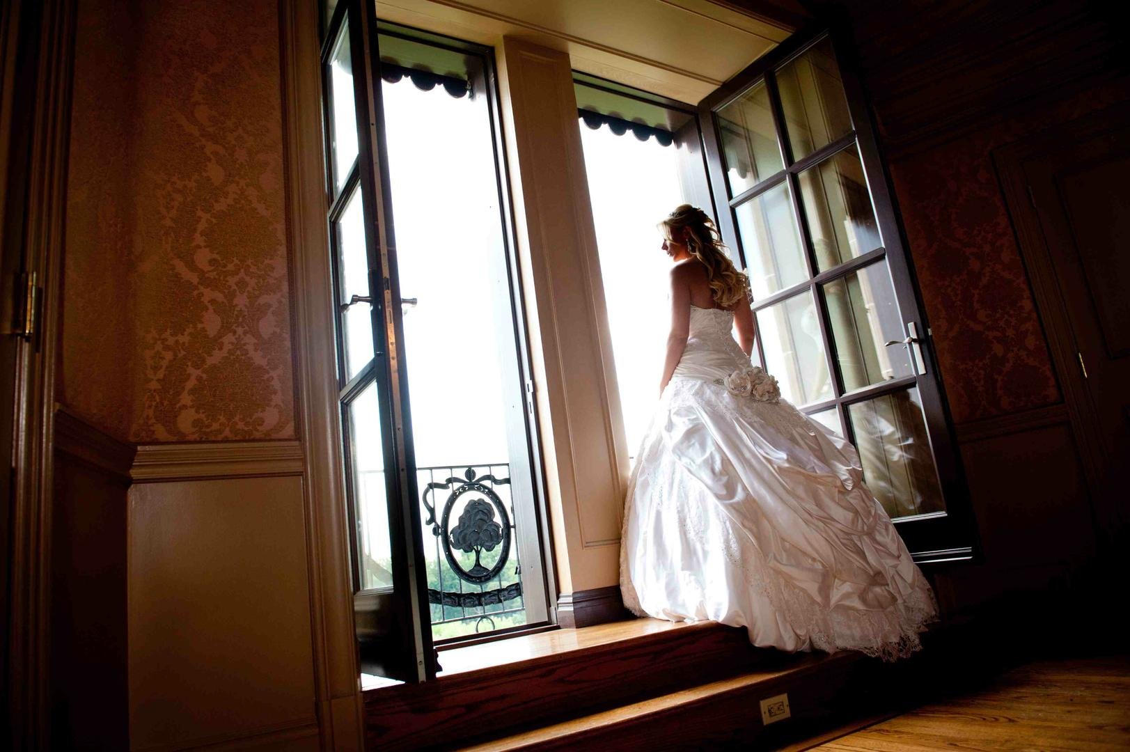 Bride Looking out Window