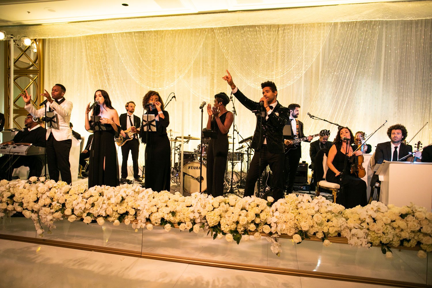 Live Band with White Flowers on Stage Live Band with White Flowers on Stage