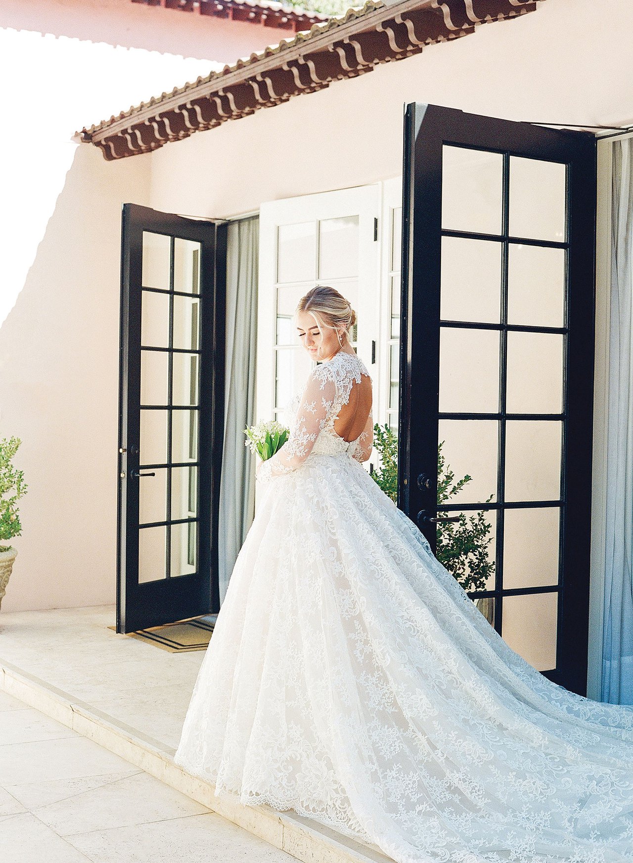 Back of Bride's Lace Keyhole Wedding Dress