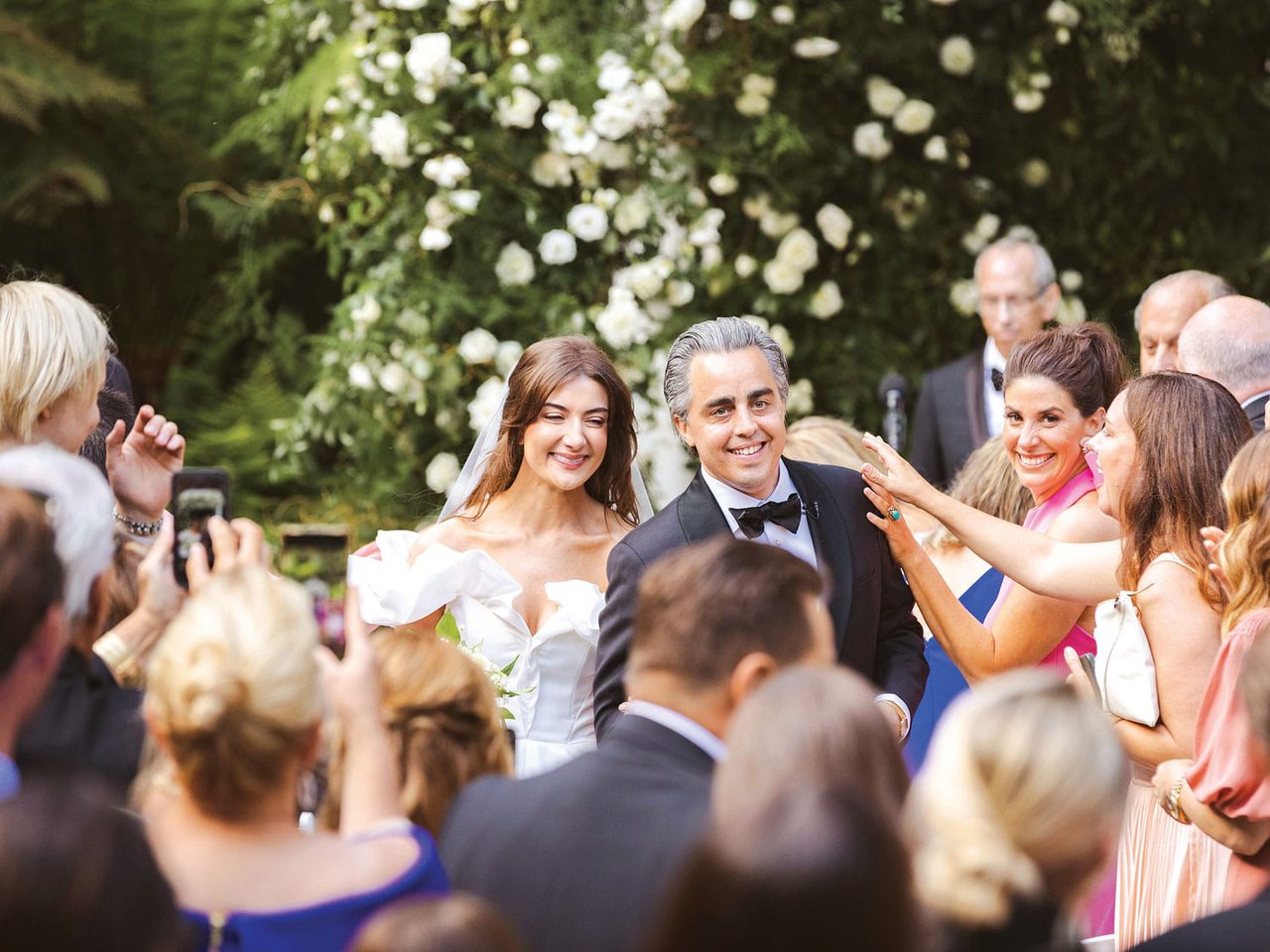 Guests Smiling During Outdoor Ceremony Recessional