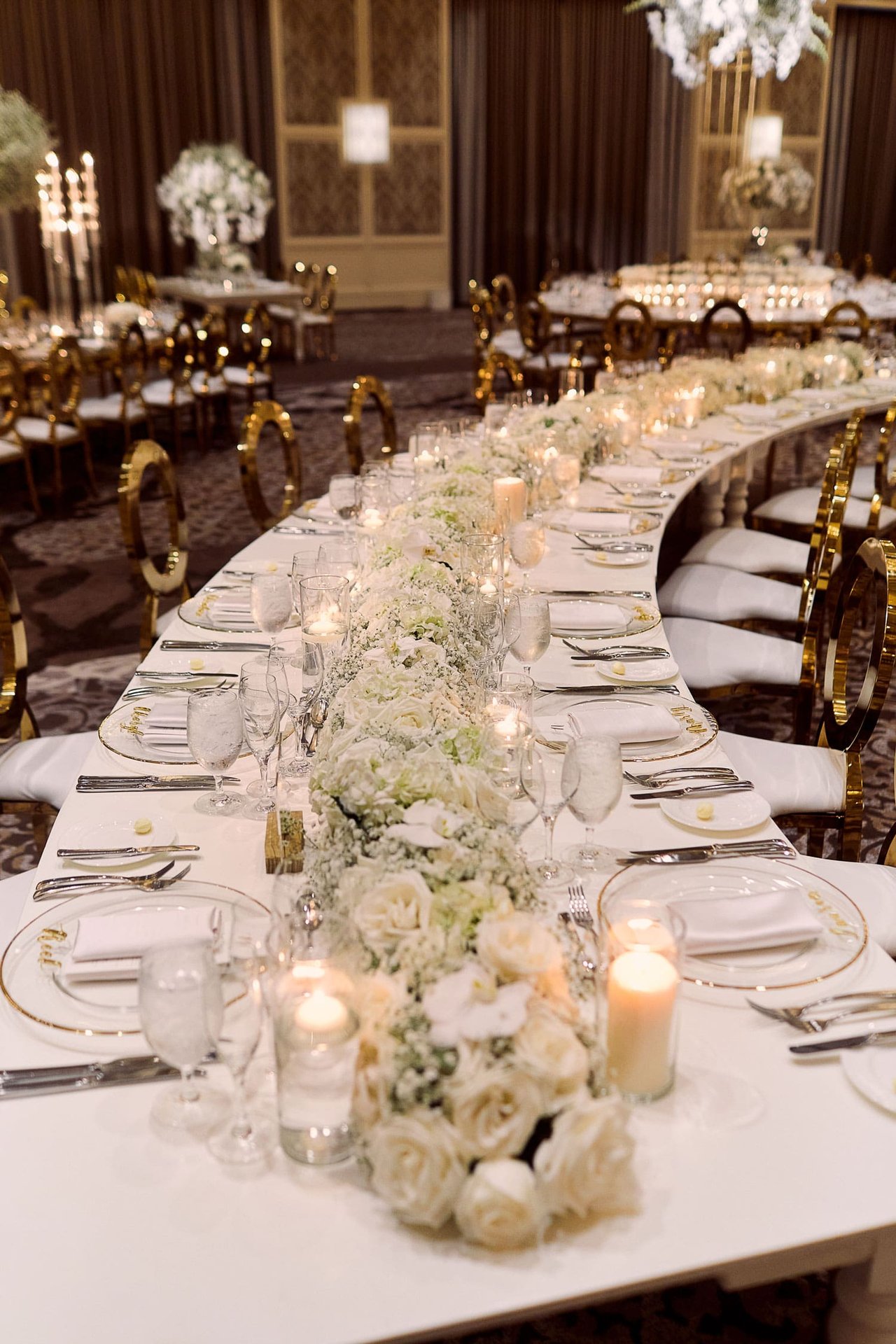 Serpentine White Table with White Flowers