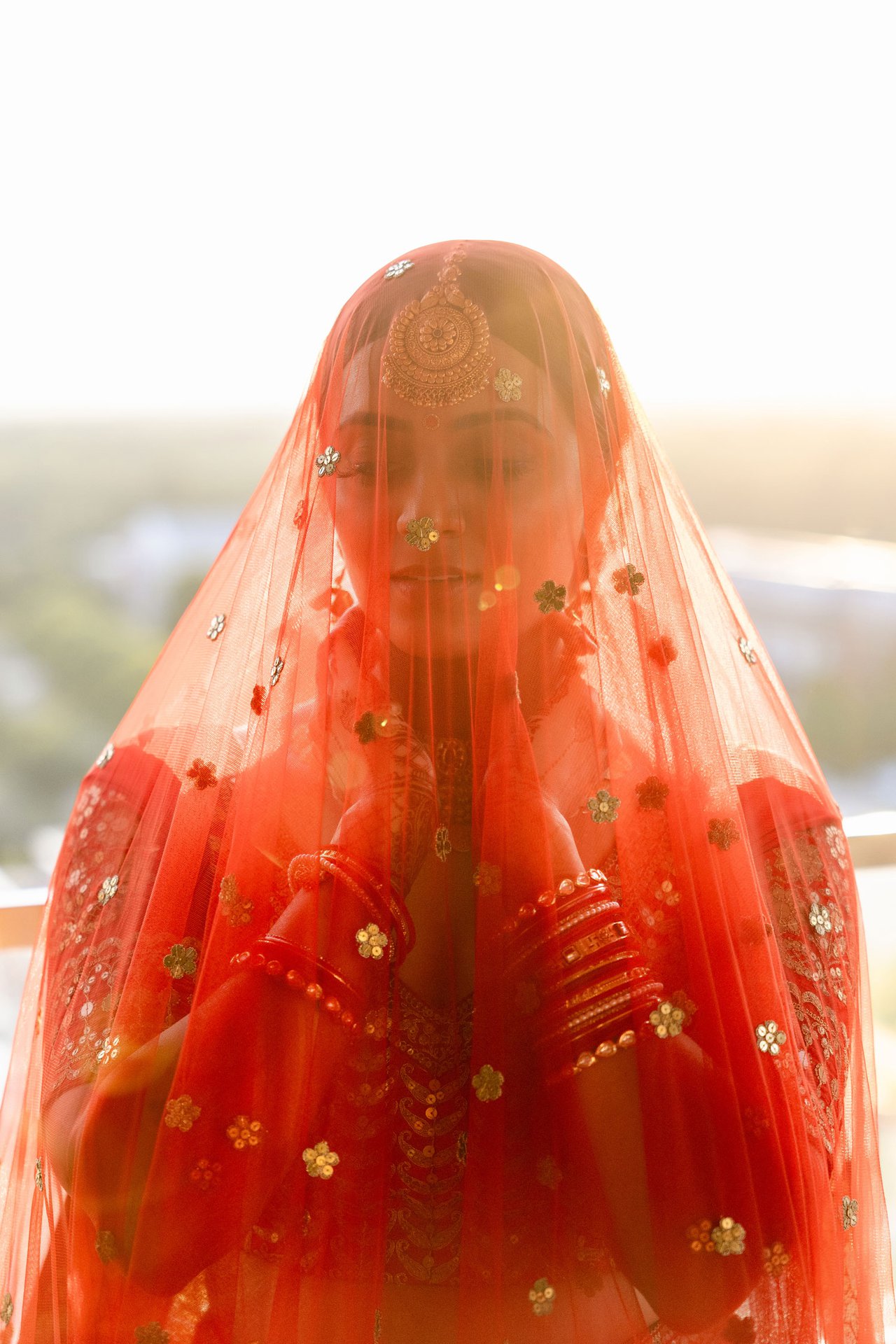 Indian Wedding Bride Under Red Veil