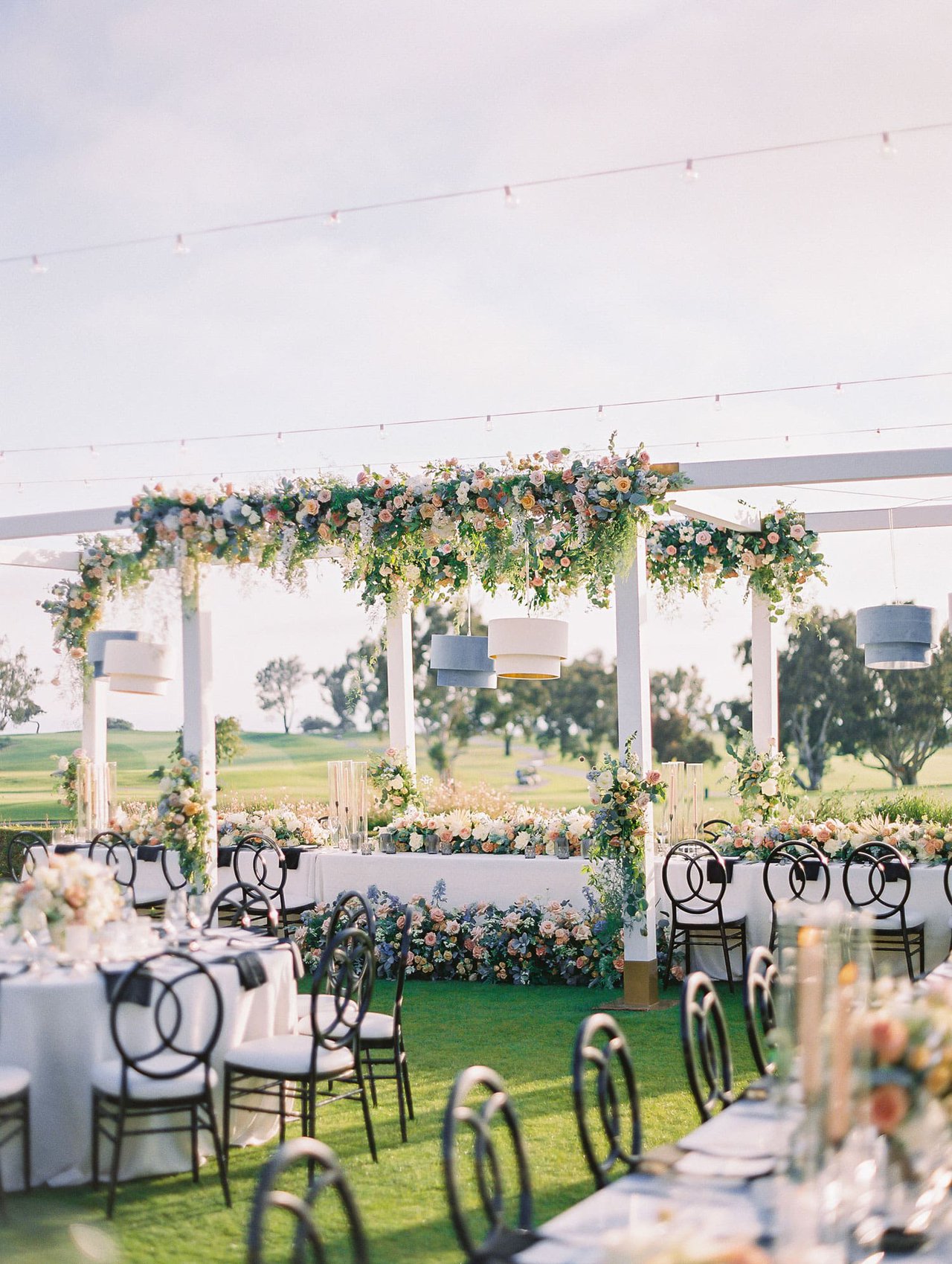 Head Wedding Table Under Floral-Embellished Structure