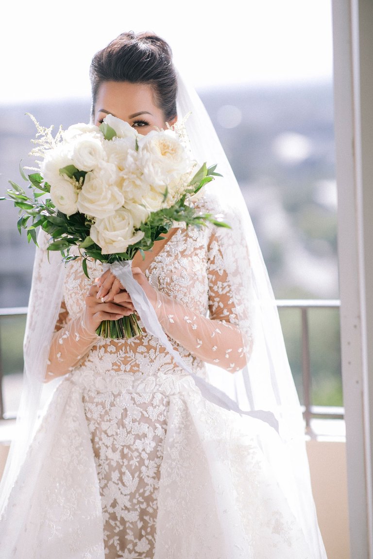Bride Smelling Gorgeous Wedding Bouquet