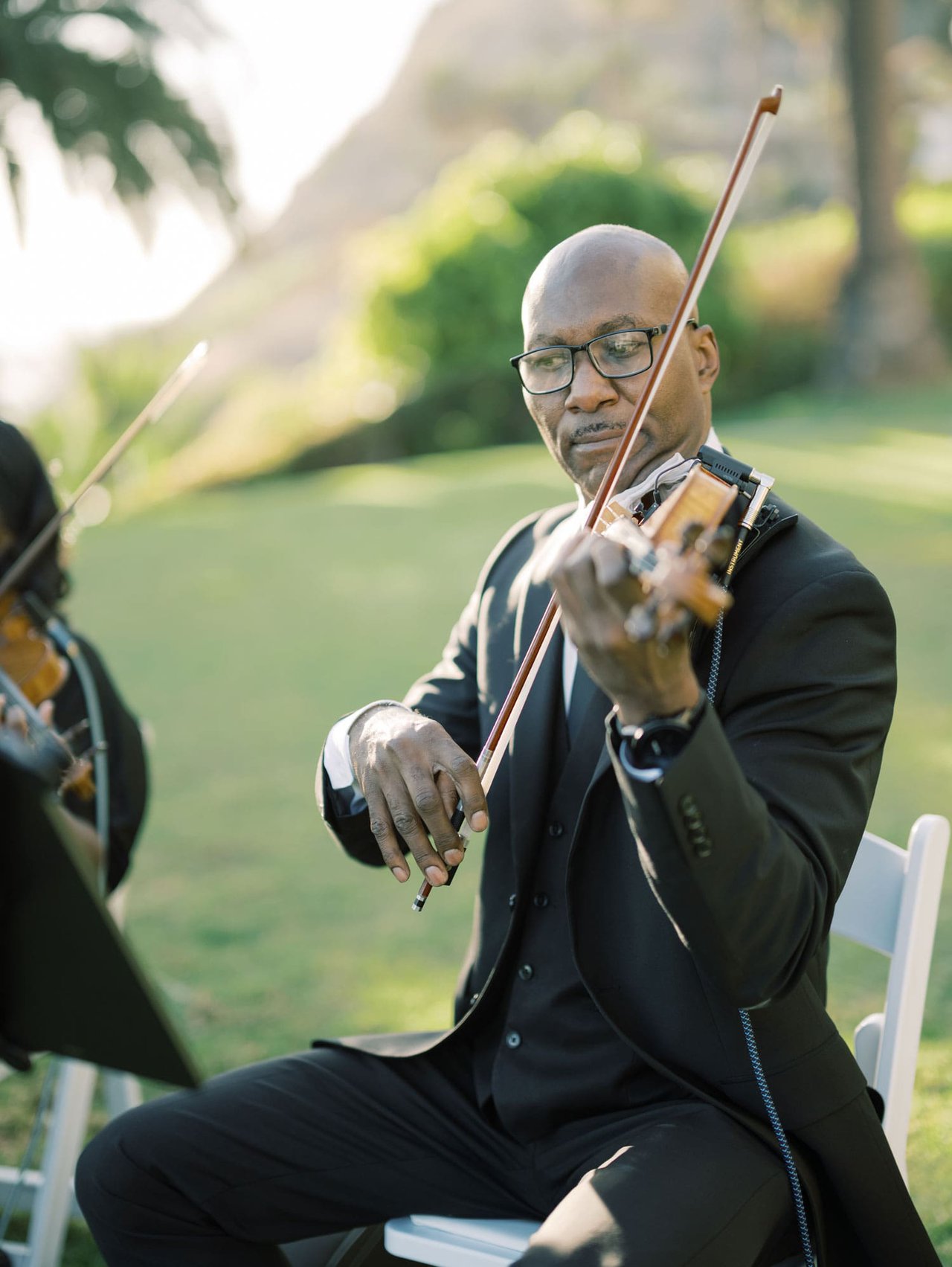 Violinist Performing at Outdoor Wedding
