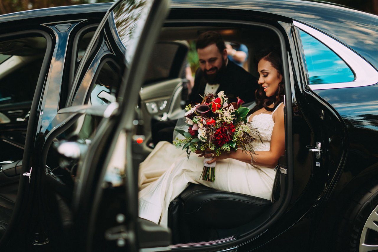 Bride & Groom Getting Into Transportation