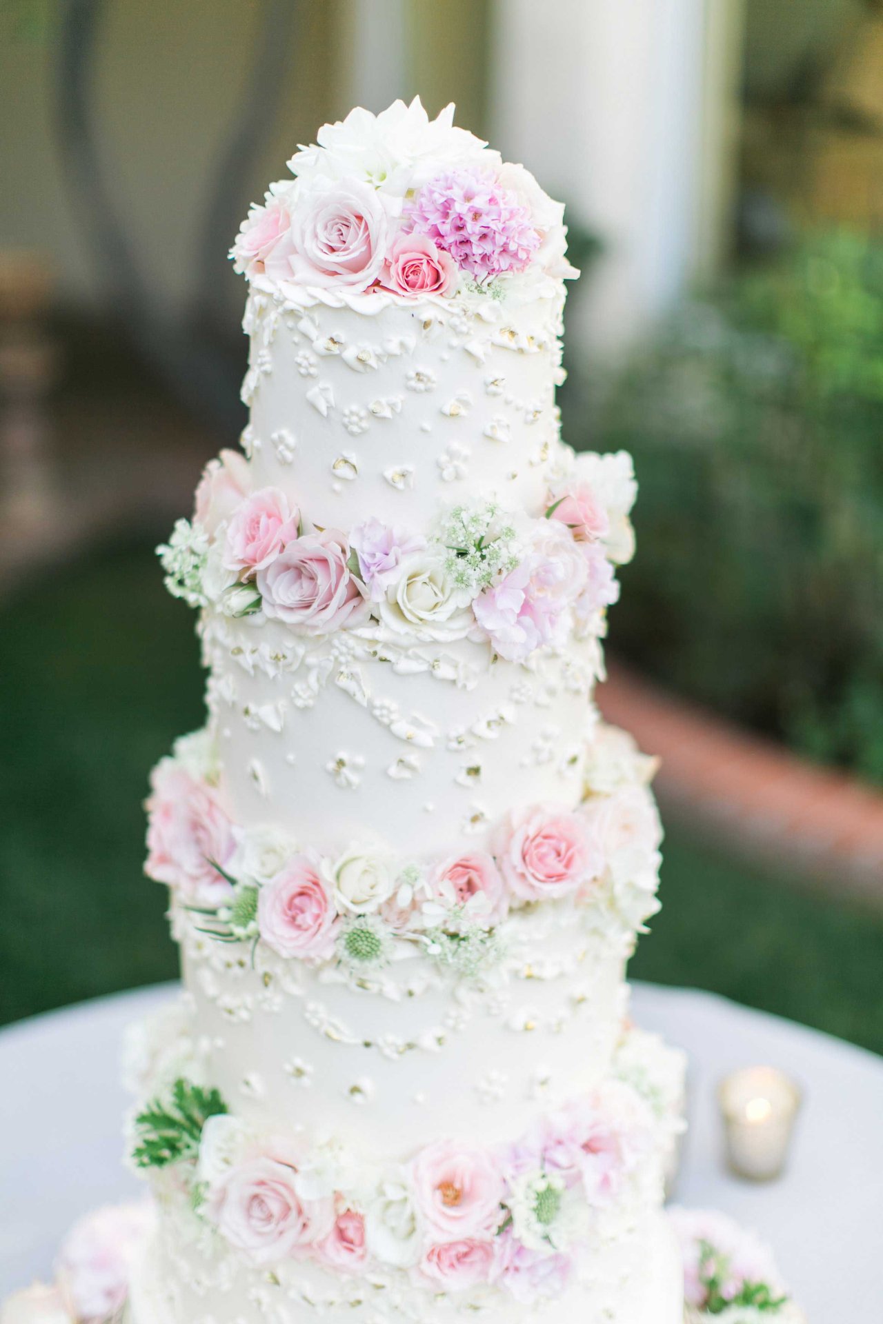 White Four-Layer Cake with Fresh Flowers