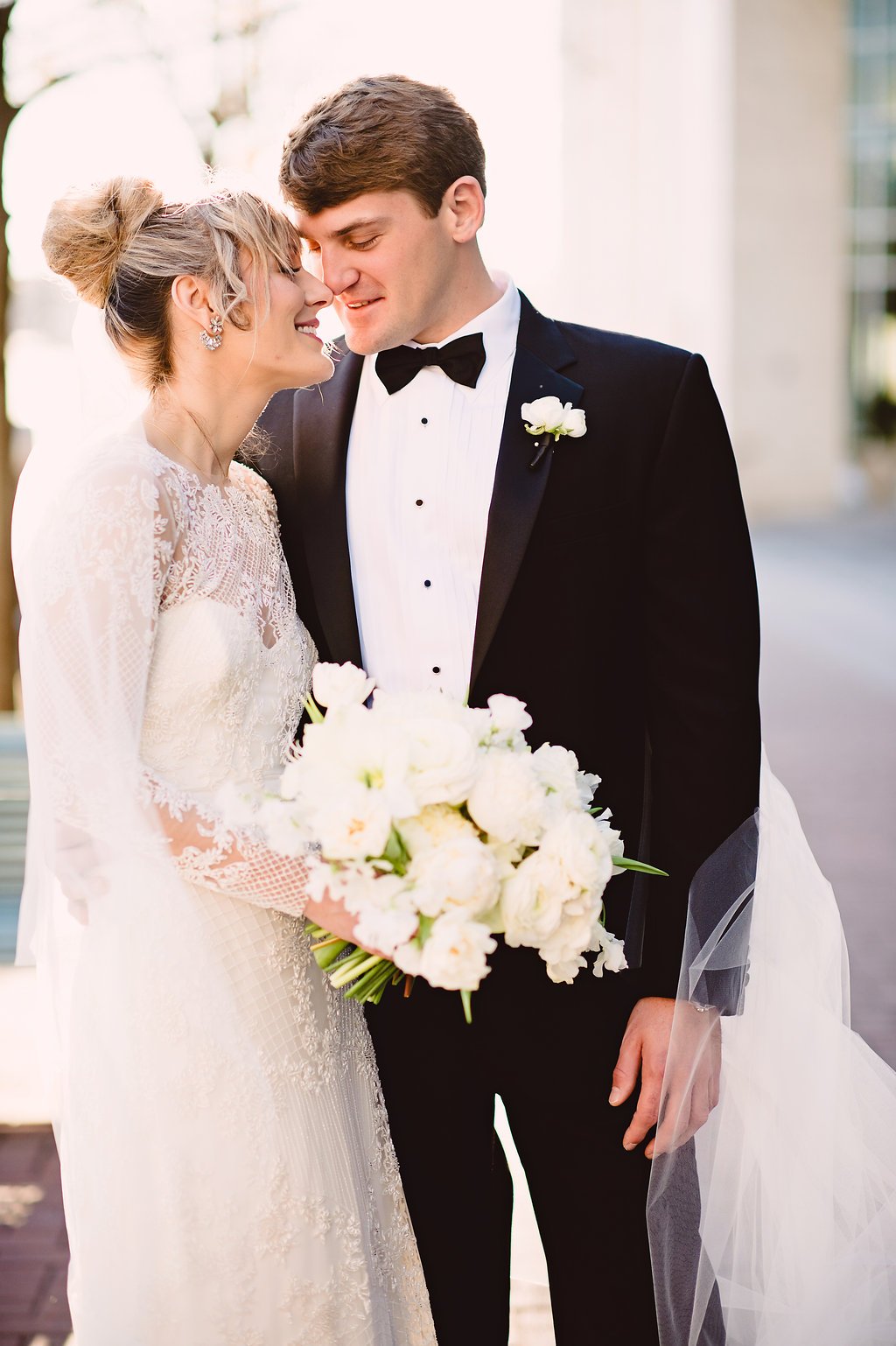 Veil Surrounds Bride and Groom During First Look