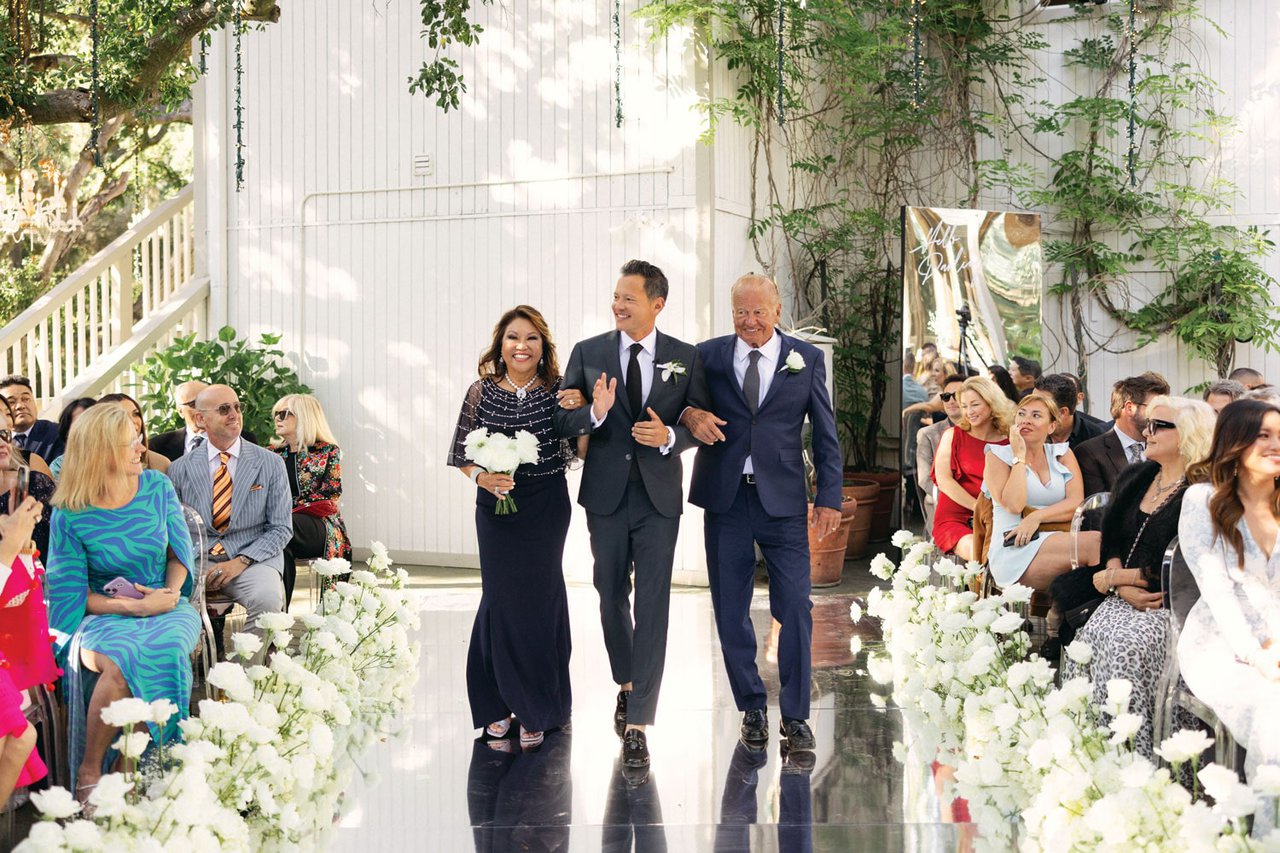 Groom Walking Down Aisle with Parents