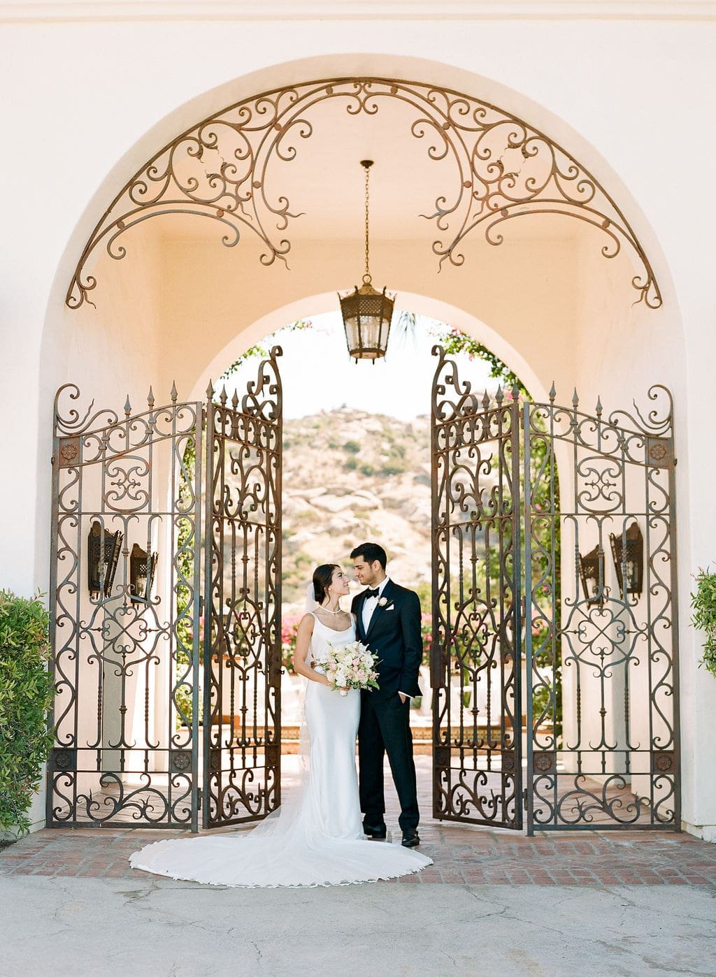Bride & Groom In Front of Wedding Gates