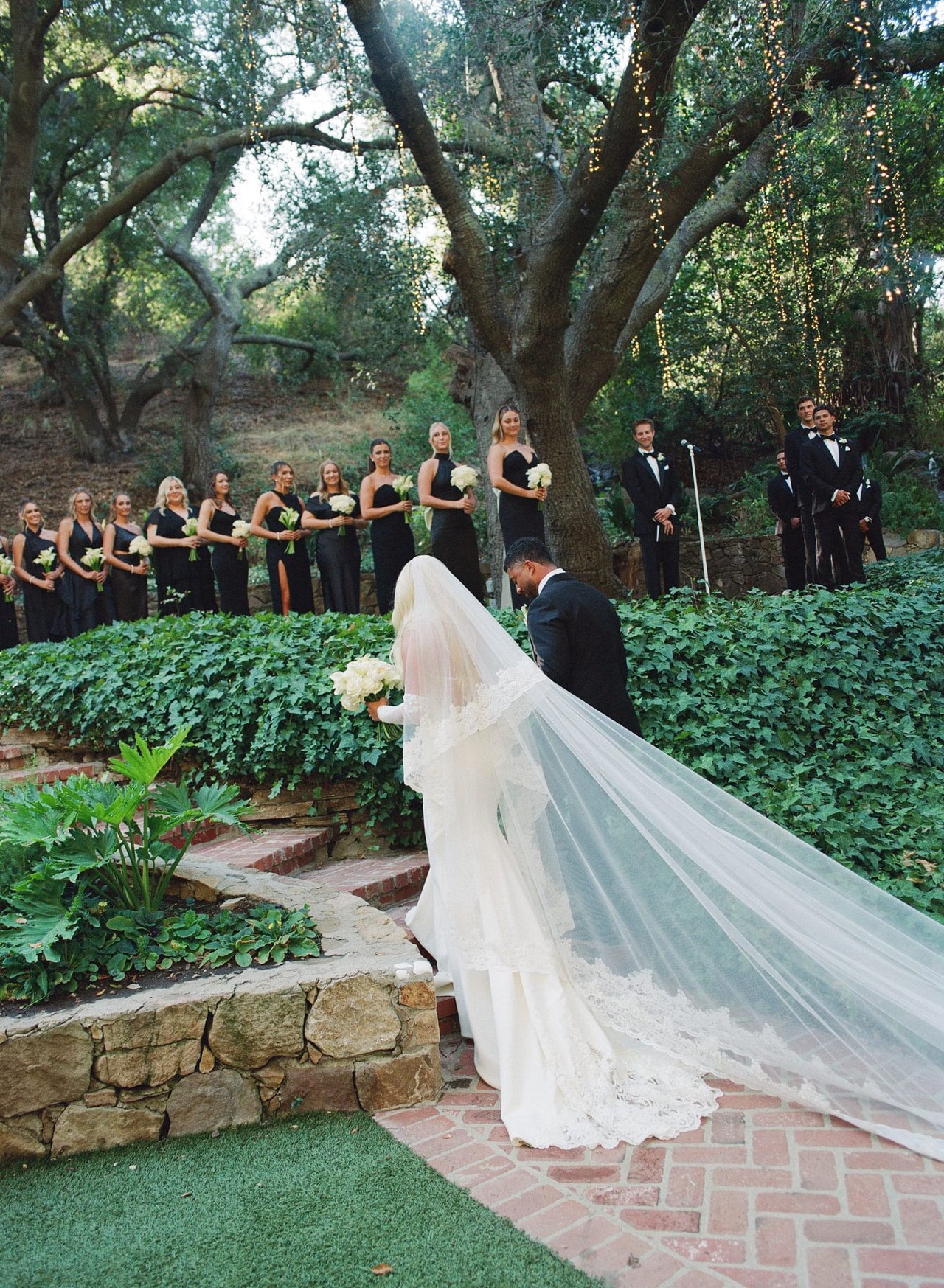 Bride & Groom Walking Up to Second Level of Ceremony