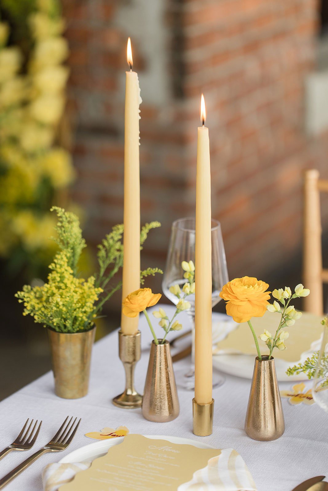 Yellow Taper Candles in Gold Candleholders