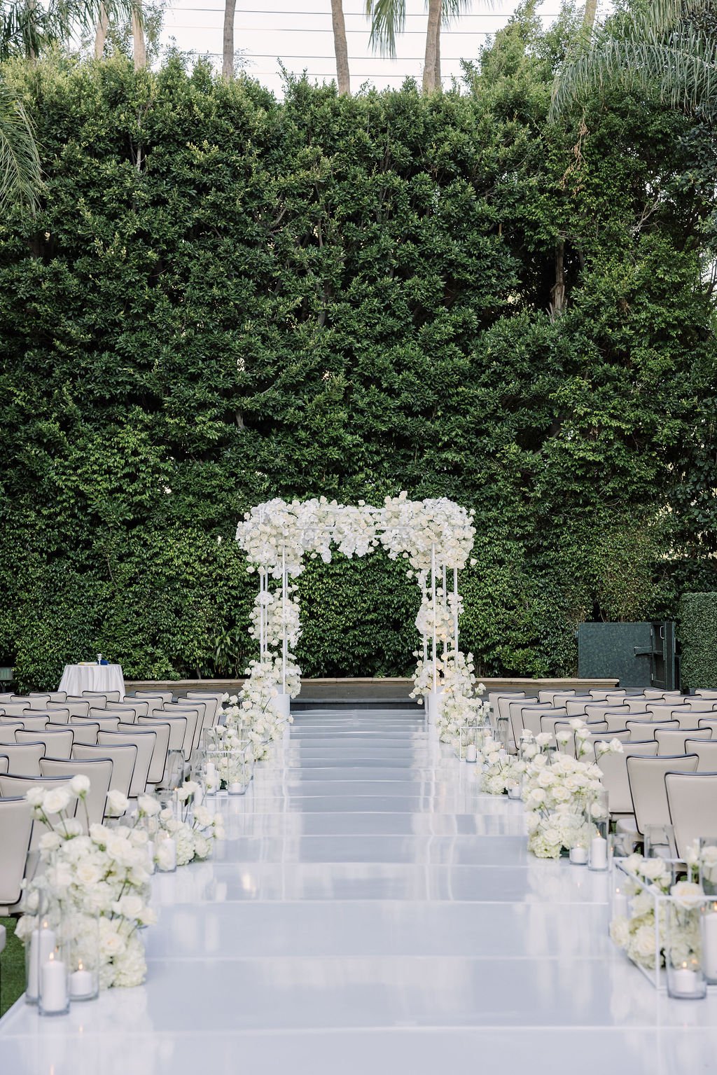 Glossy White Aisle Leading to White Chuppah