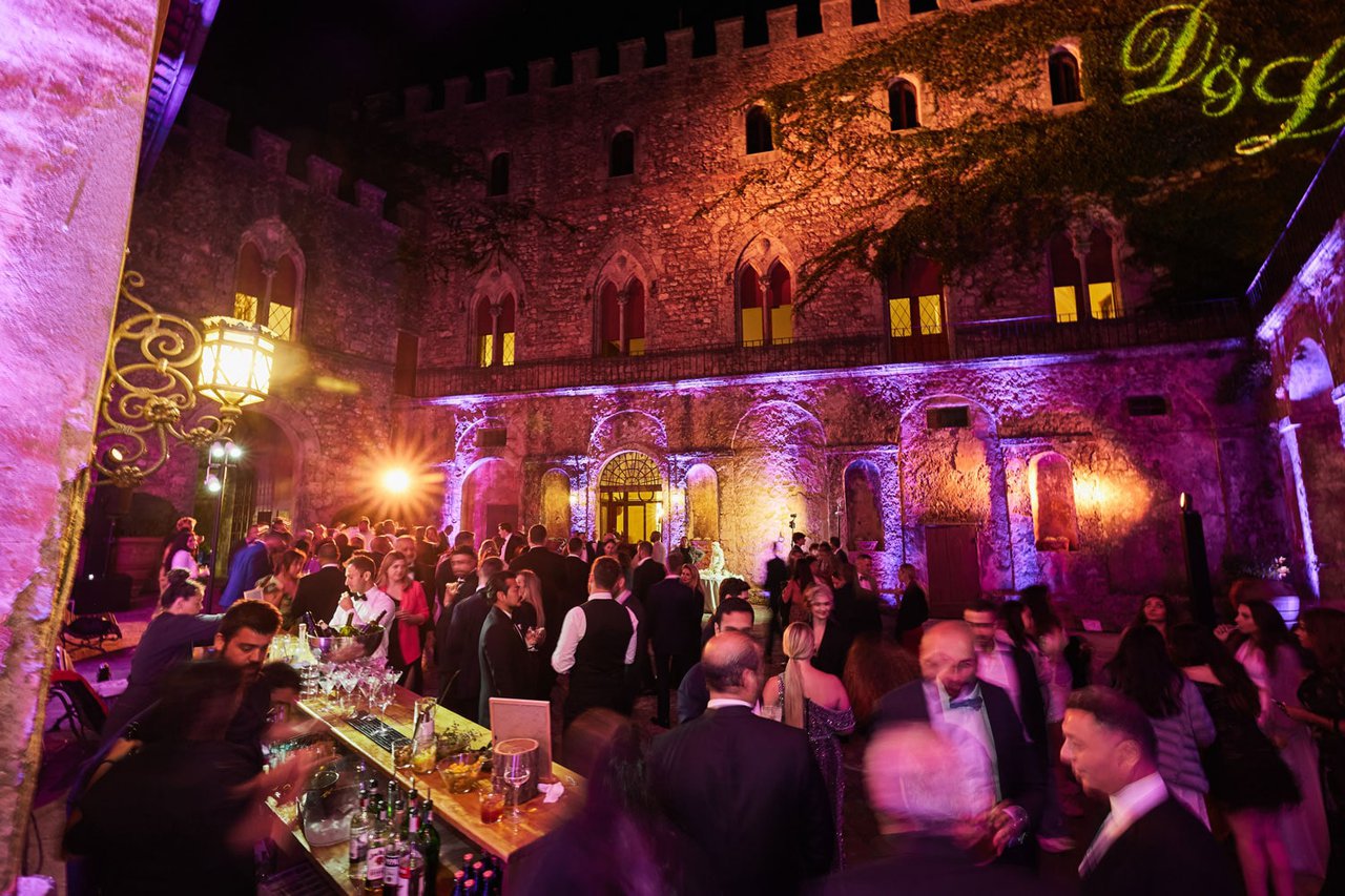 Vibrant Lighting at Outdoor Castle Wedding