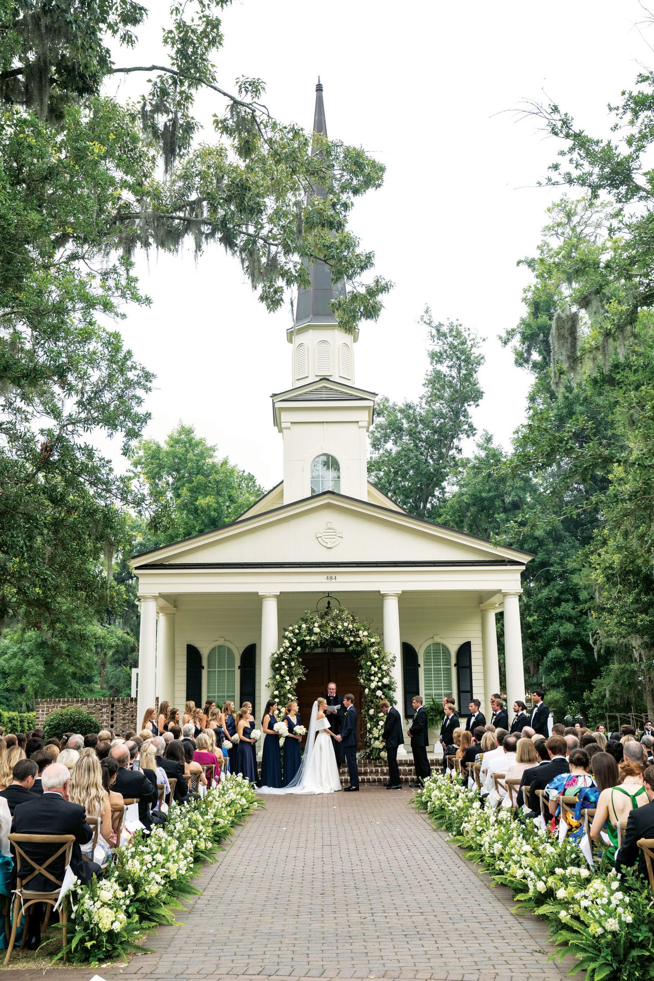 Outdoor Wedding Ceremony in Front of Chapel