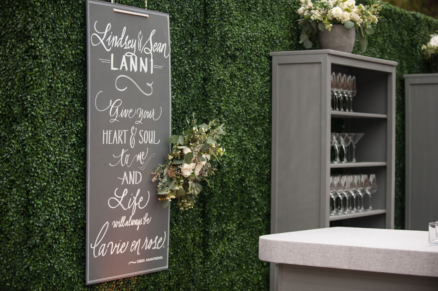Hedge Wall with Signage at Wedding