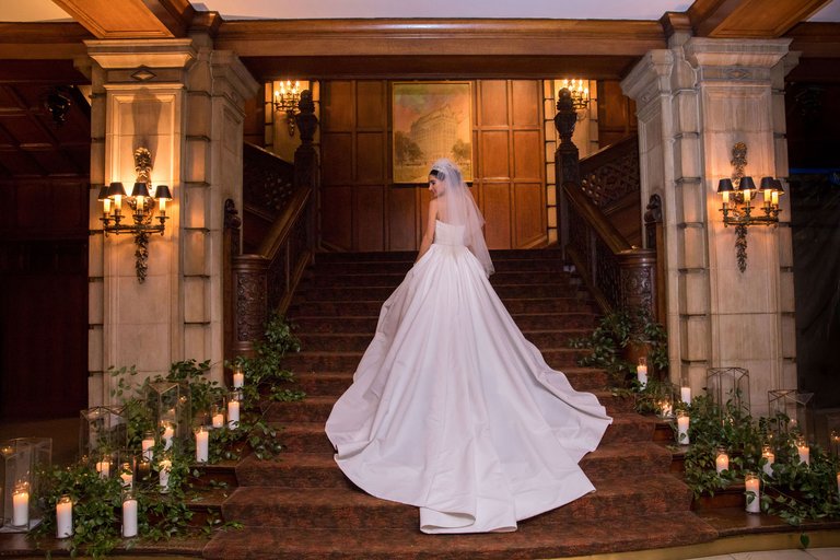 Bride on Staircase with Bridal Train