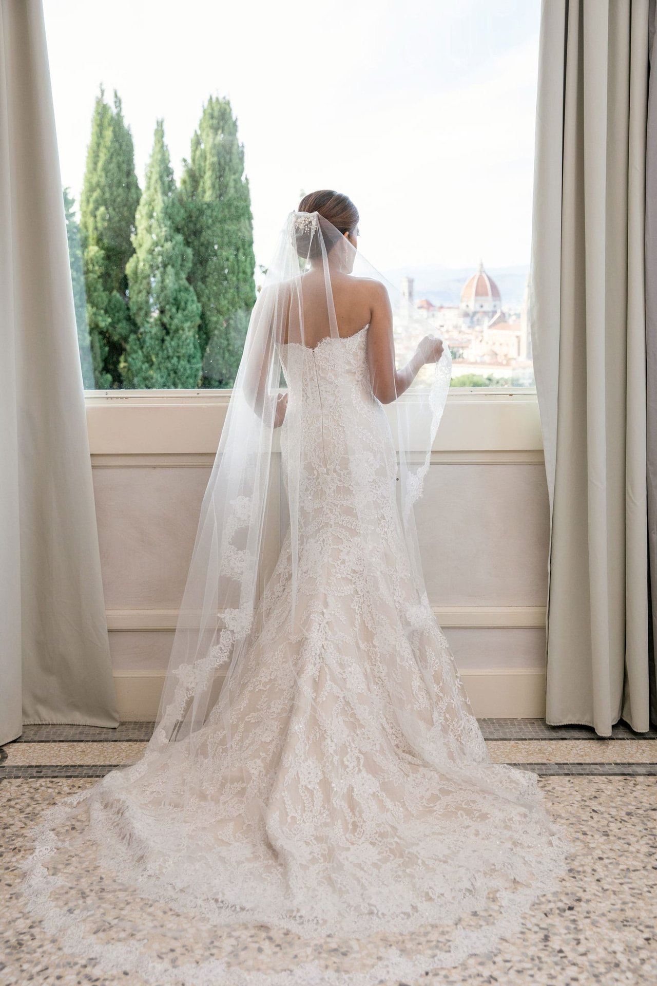 Bride Looking Out Window in Florence, Italy