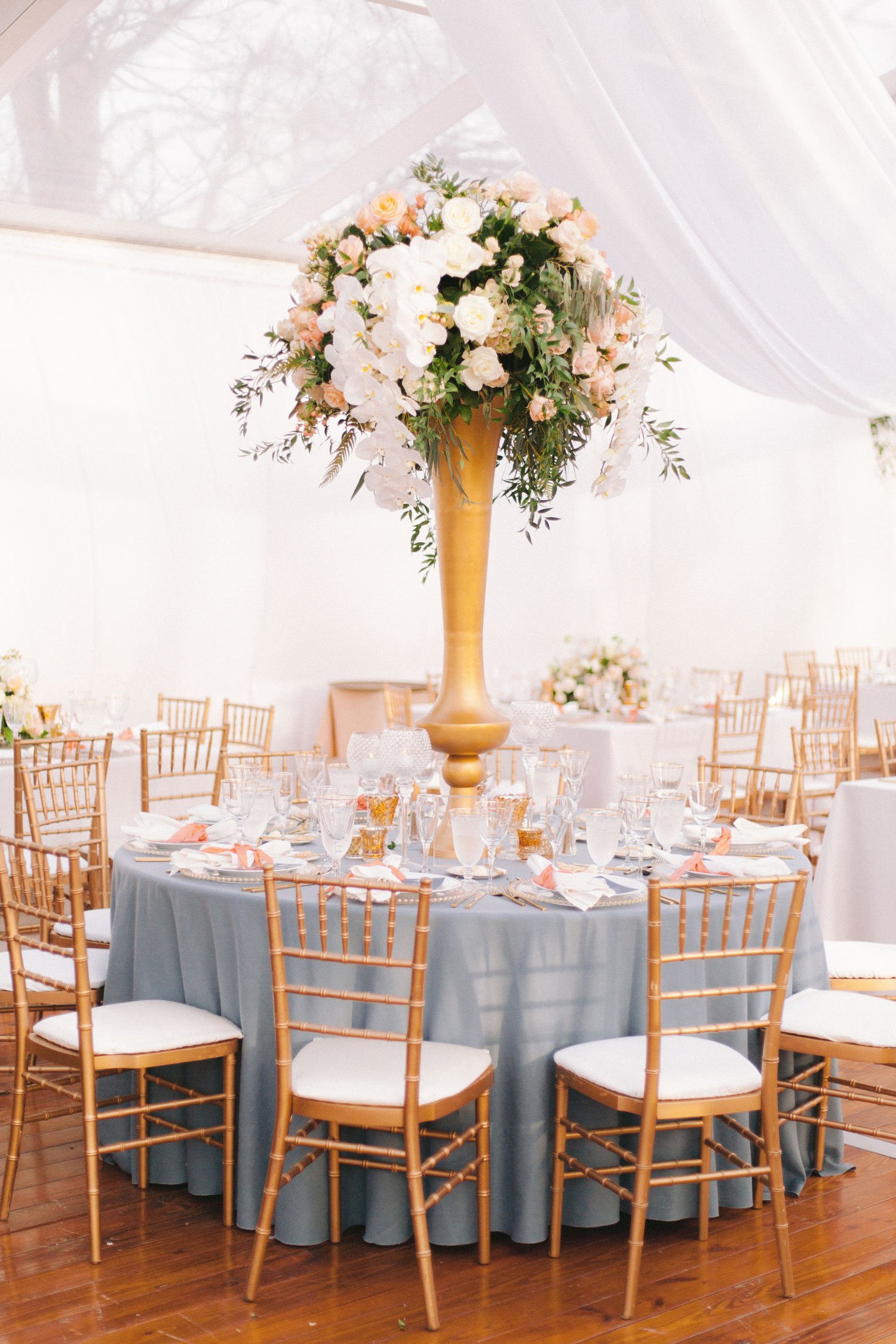 Tall Gold Centerpiece on Round Table