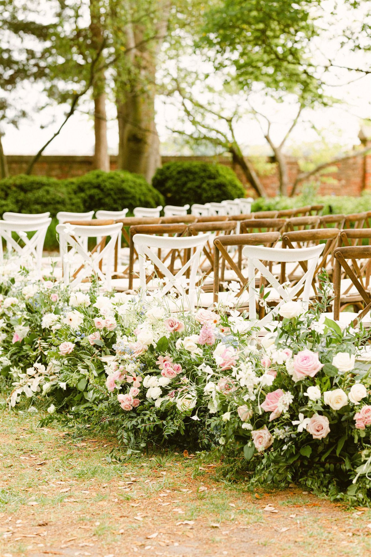 White, Pink & Blue Flowers Along Aisle