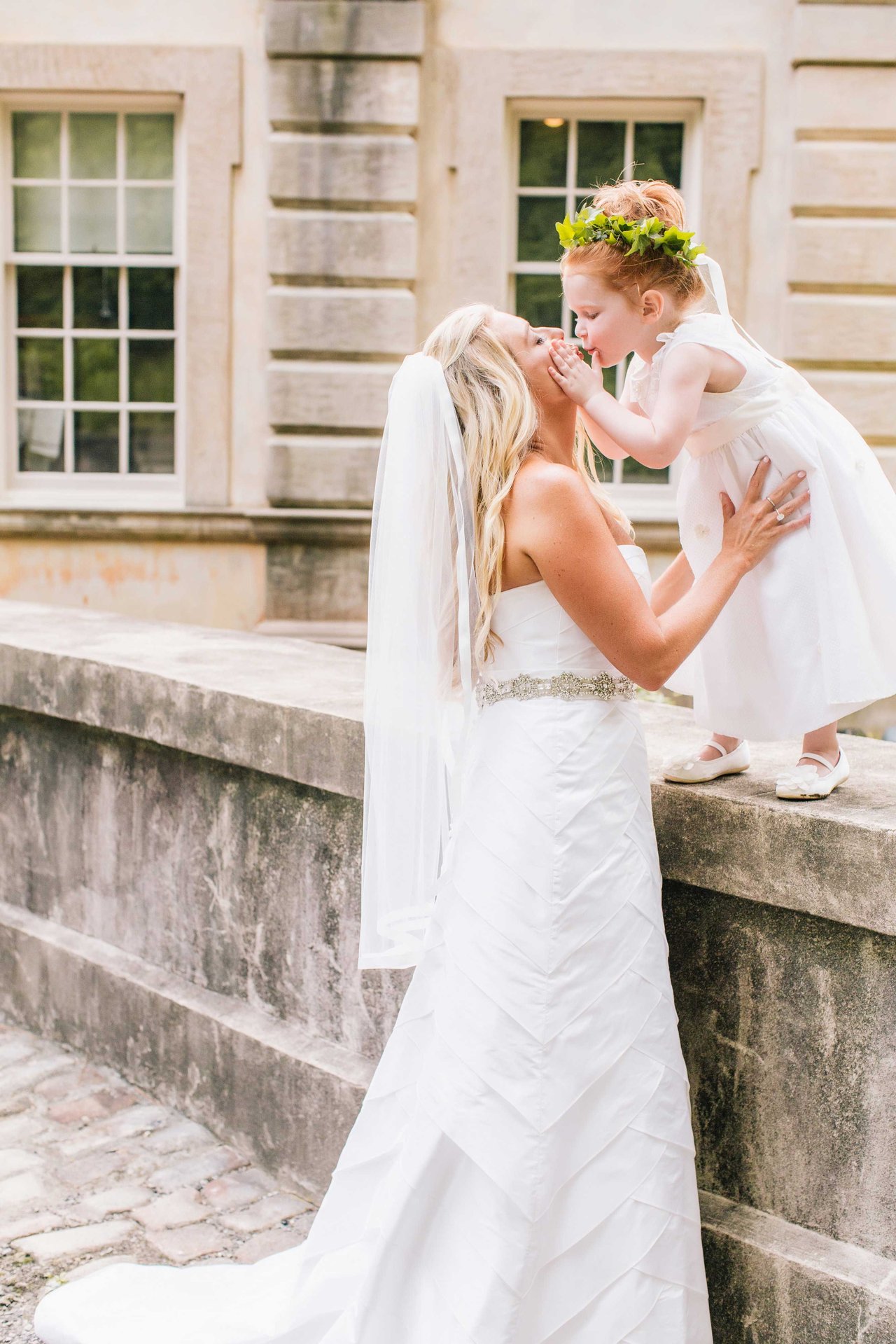 Flower Girl Kisses Bride in Green Crown