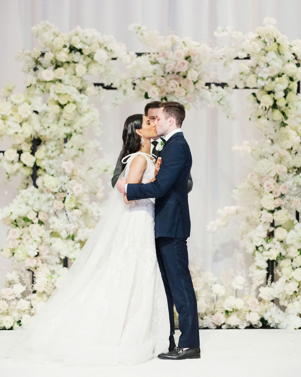Bride & Groom Kiss at Western Wedding Ceremony