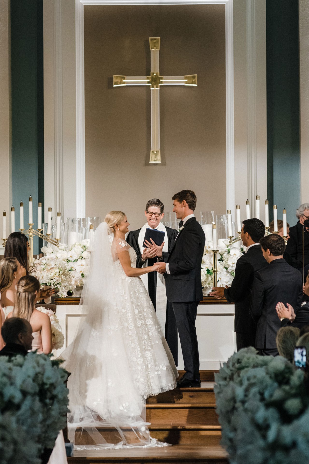 Bride & Groom with Pastor at Church Altar