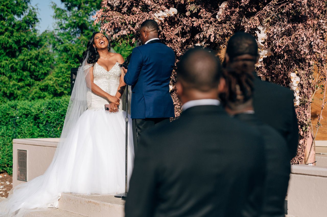 Bride Laughing During Wedding Ceremony