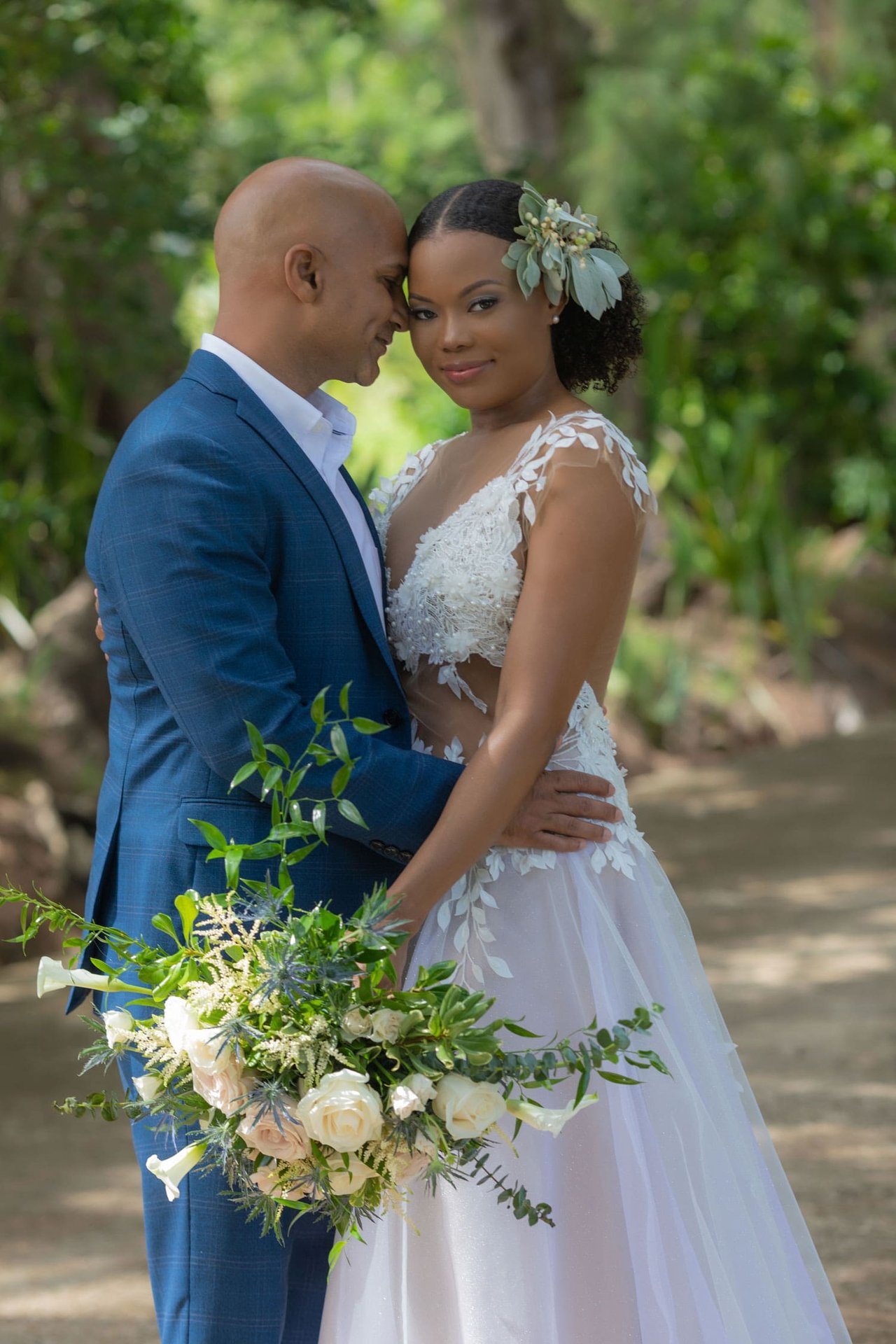 Bride in Illusion Gown with Groom in Blue Suit