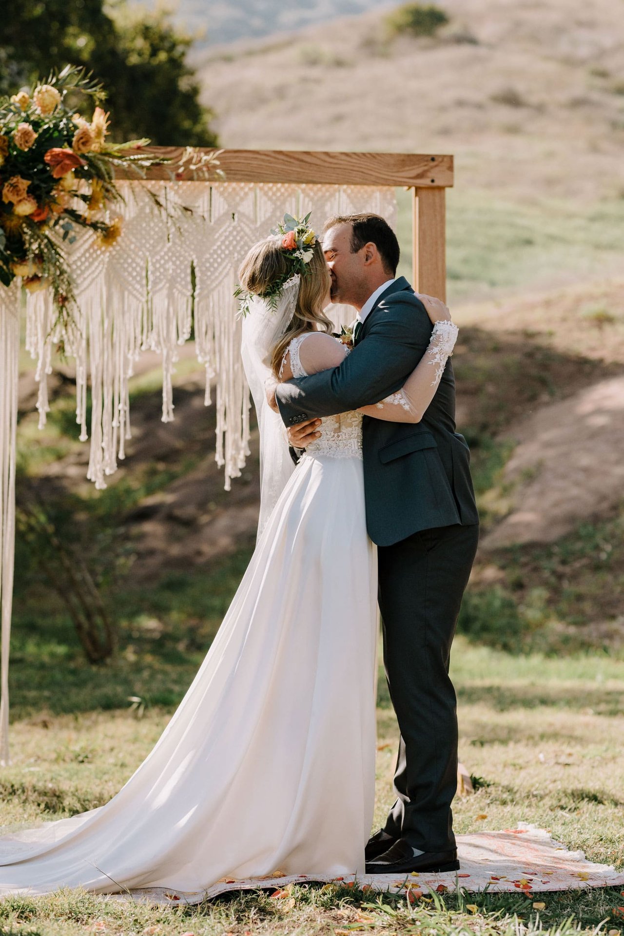 Bride & Groom Kiss at Boho Ceremony