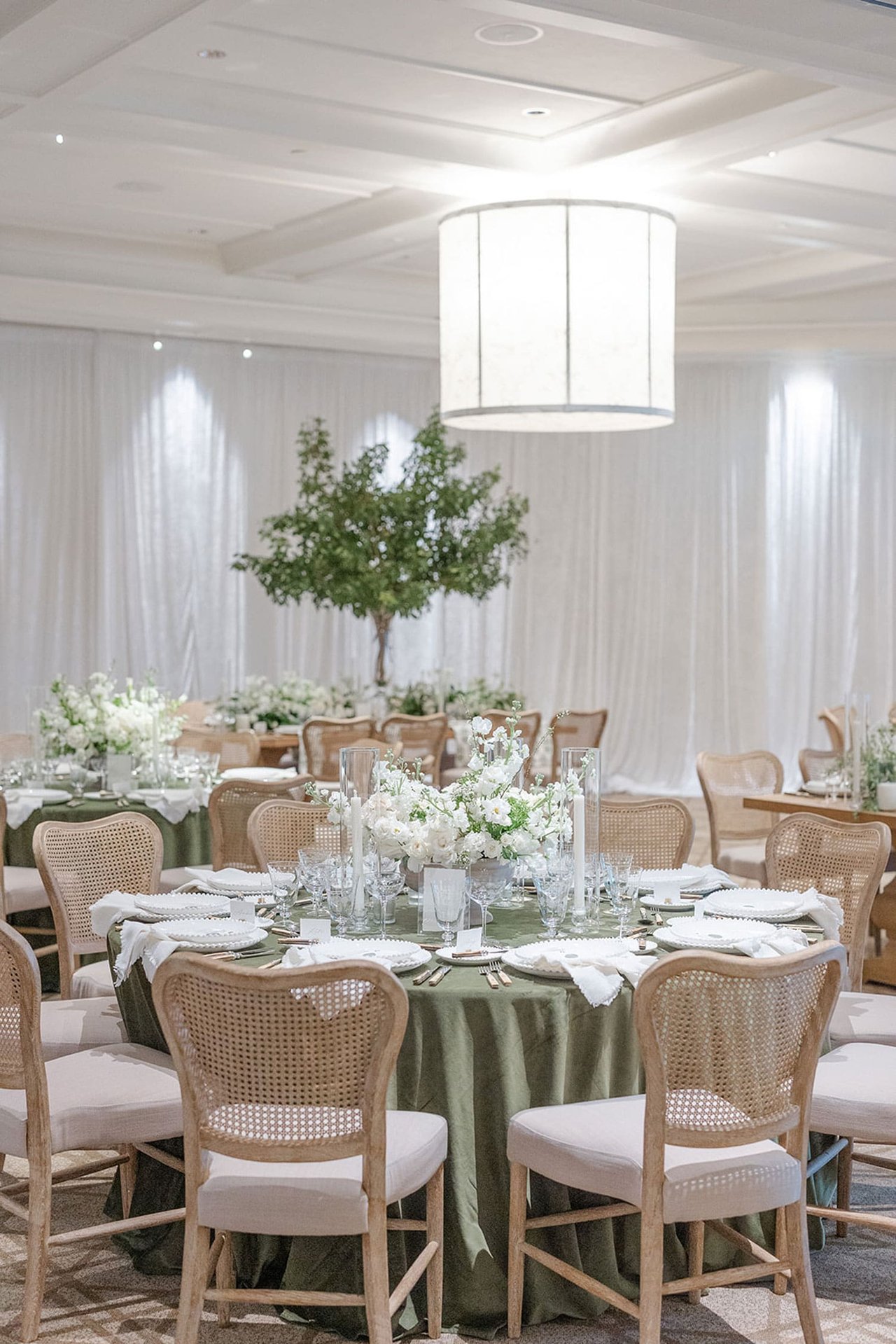Green Table Linens and Cane-Back Chairs