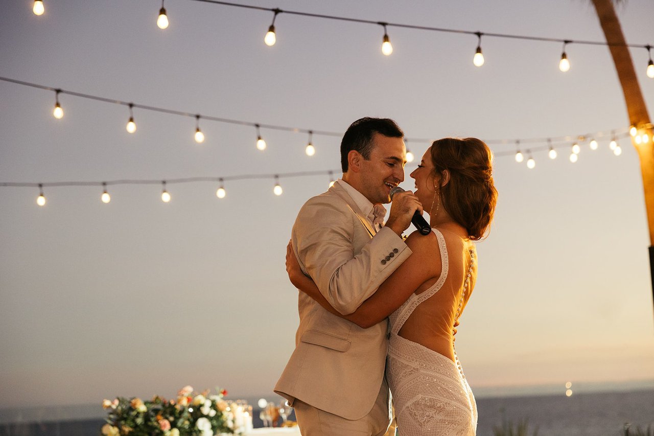 Groom Singing to Bride After First Dance