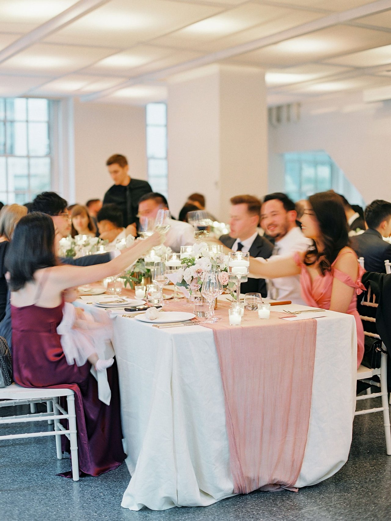 Guests Toasting at Loft Wedding Reception