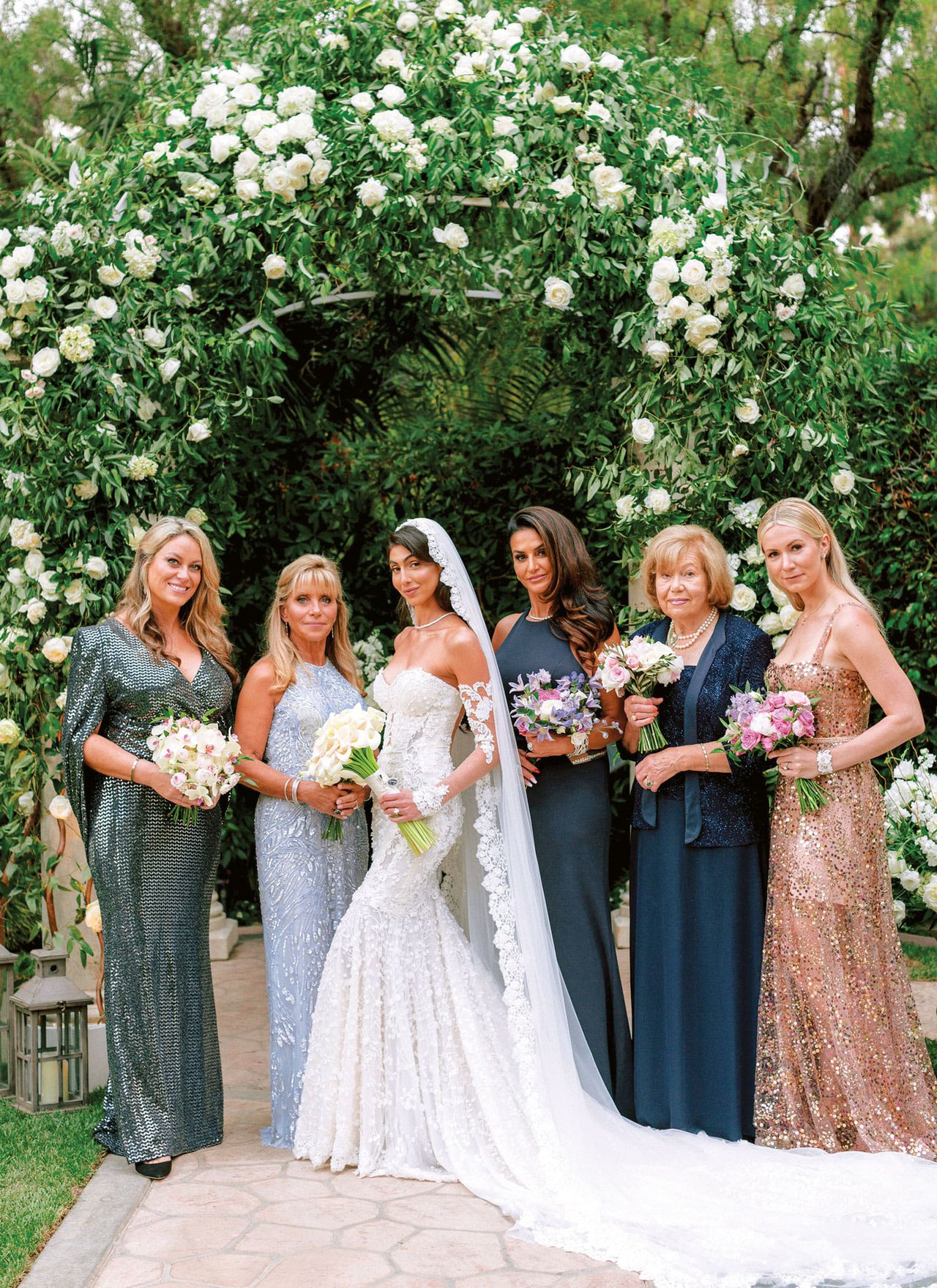 Bride with Family Members Holding Bouquets
