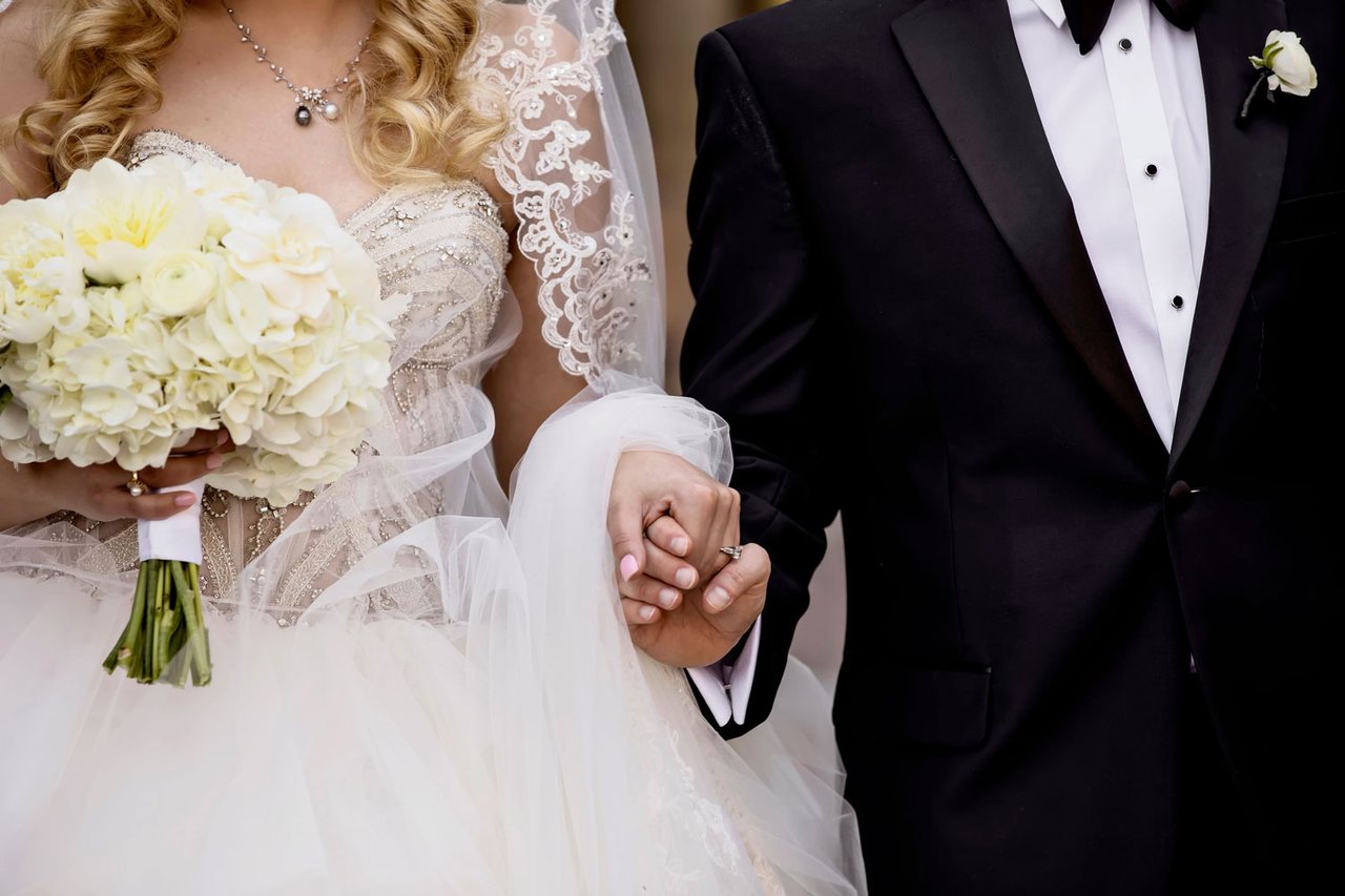Close Up of Bride & Groom Holding Hands