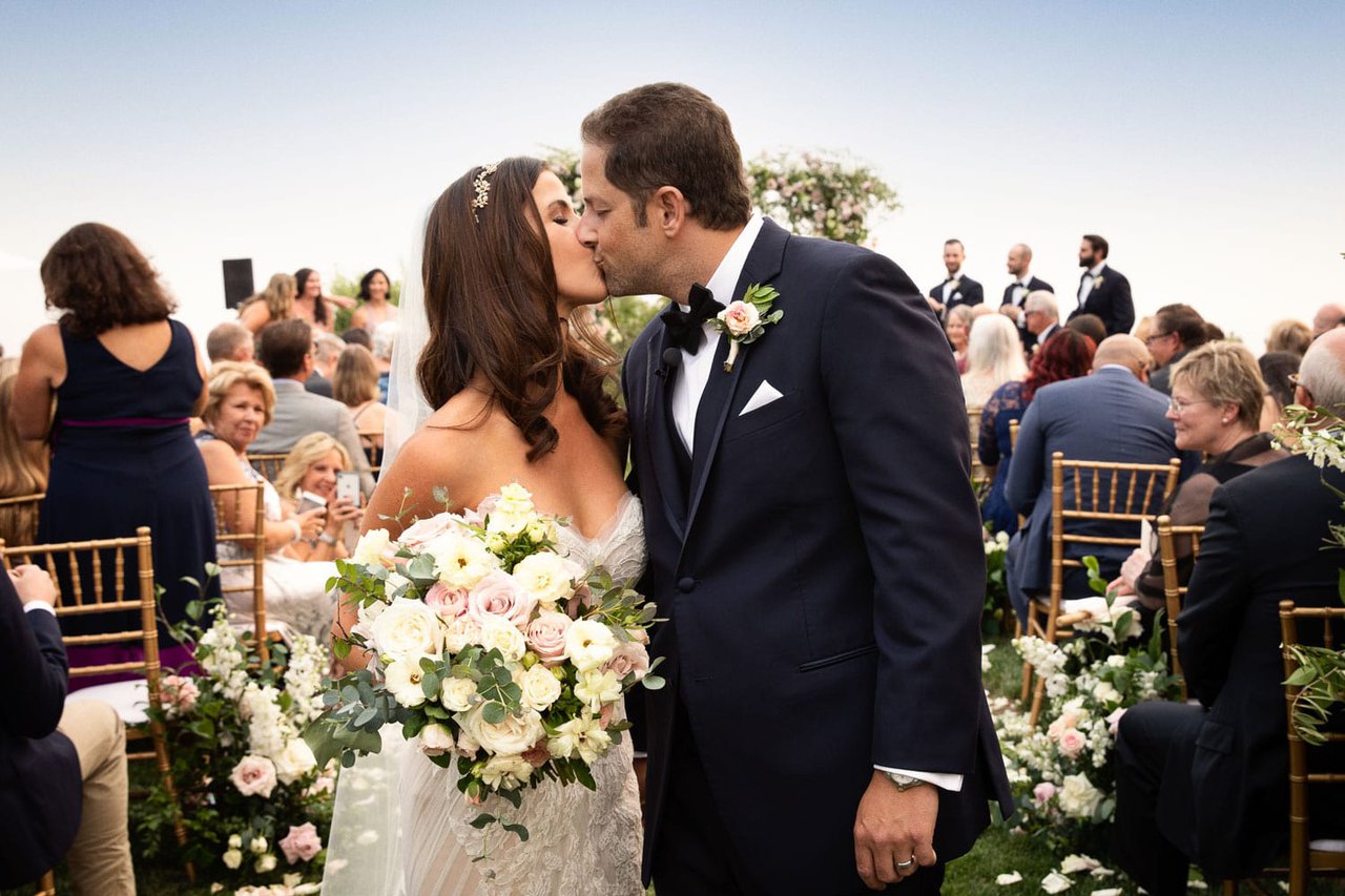 Bride & Groom Kiss at End of Aisle