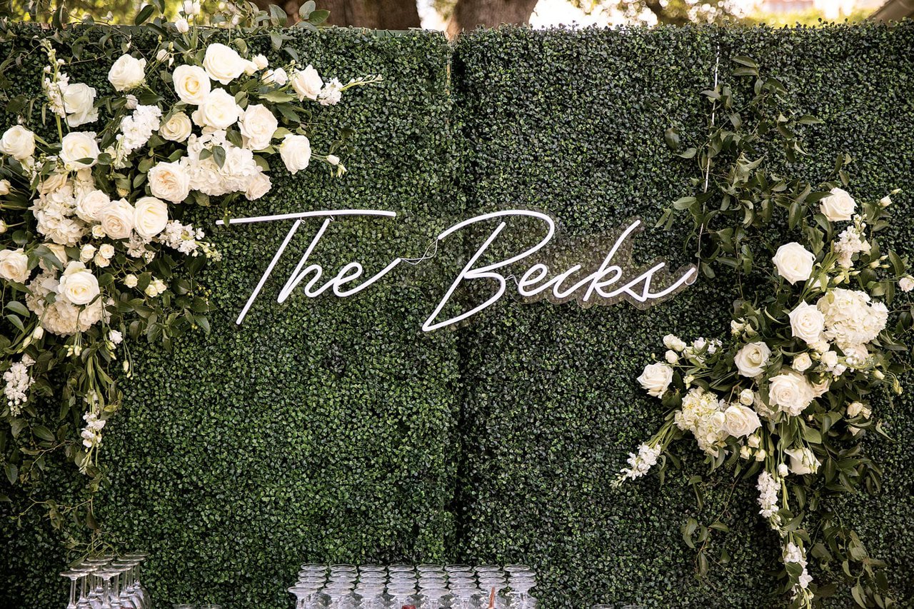 Greenery Wall with Neon Sign at Wedding