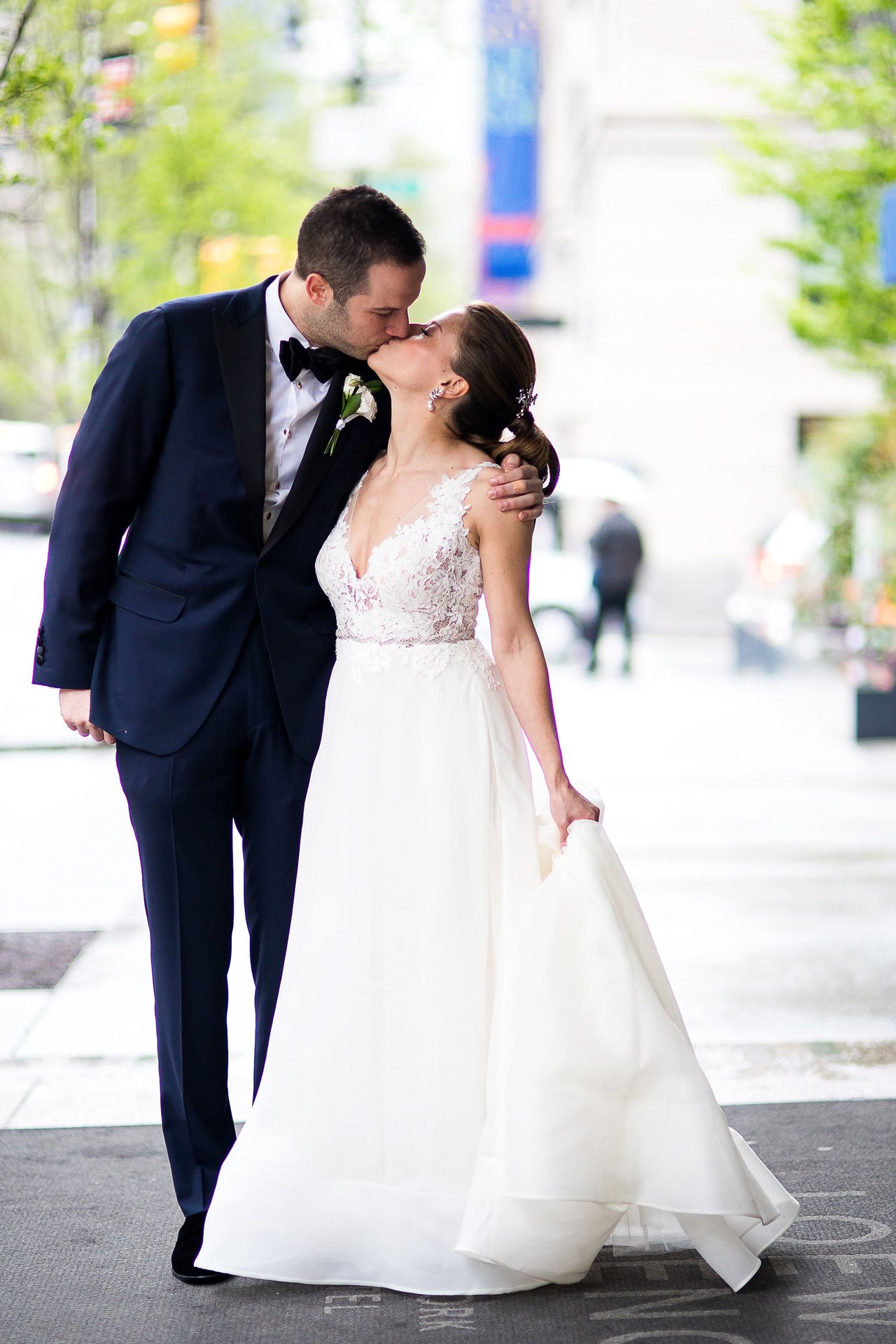 Bride in A-Line Gown Kissing Groom