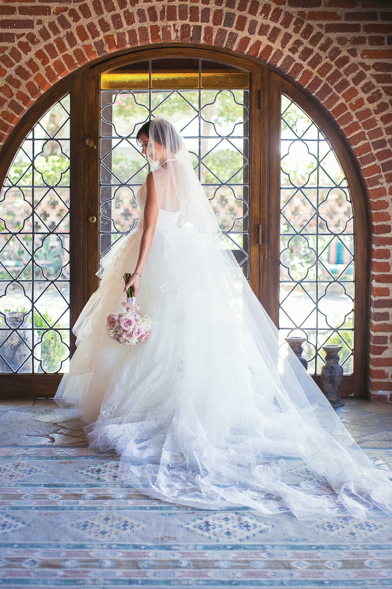 Bride Shows Off Back of Ball Gown