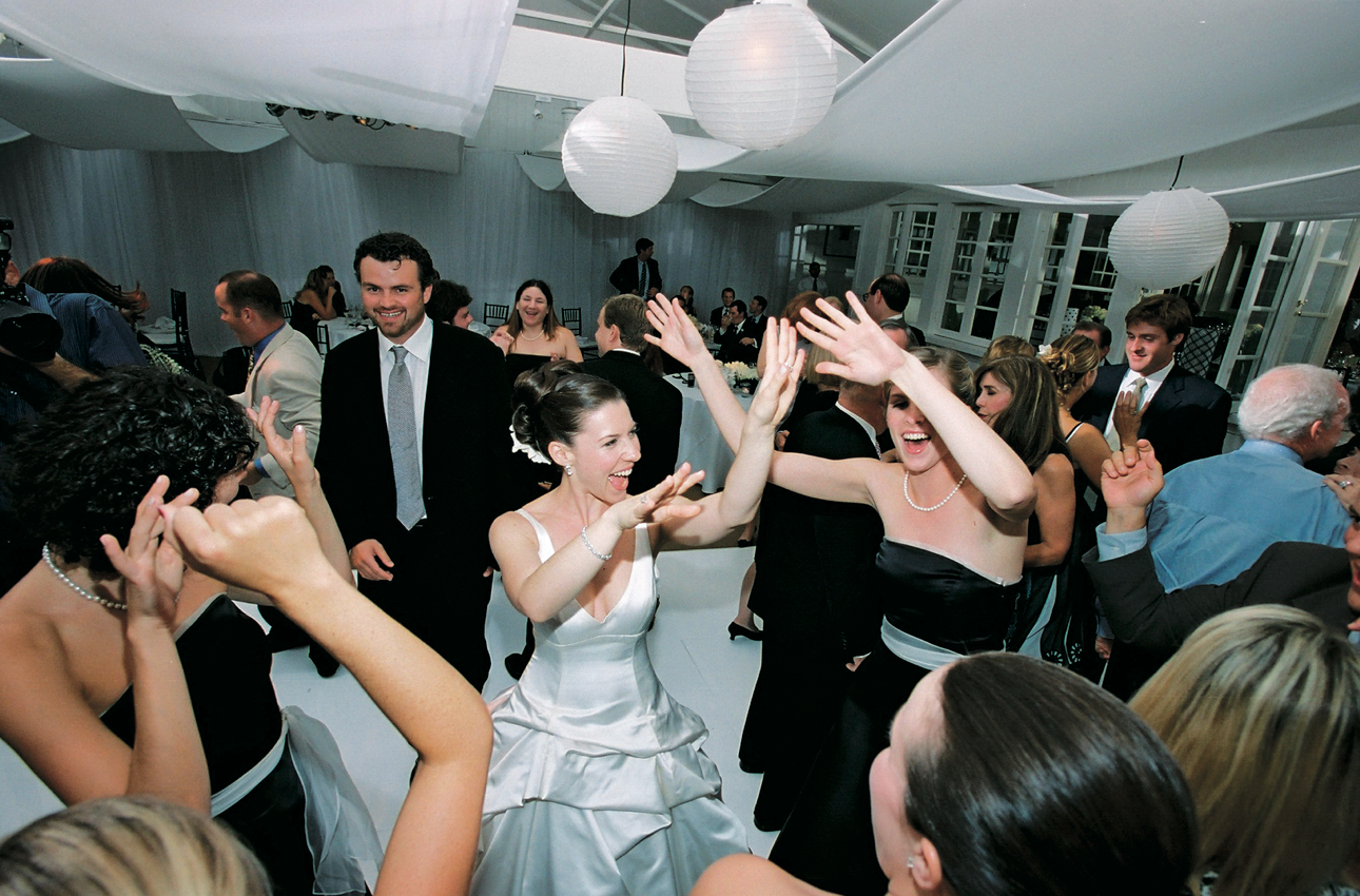 Dancing guests partying at the reception