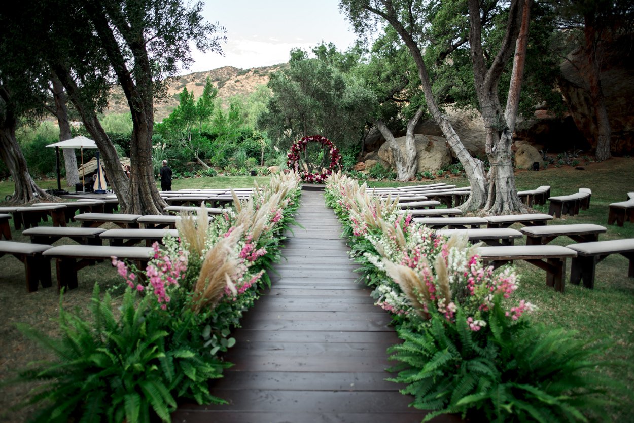Lush Lining of Wooden Aisle