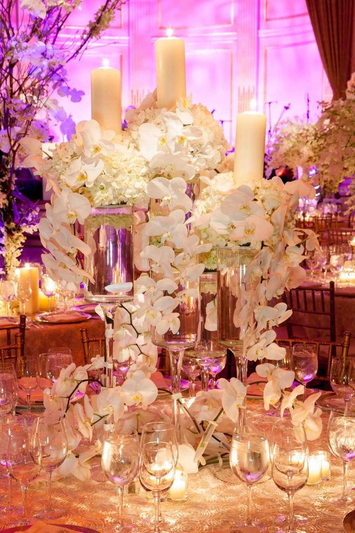 Reception Décor Photos - Draped Orchid Table Décor - Inside Weddings