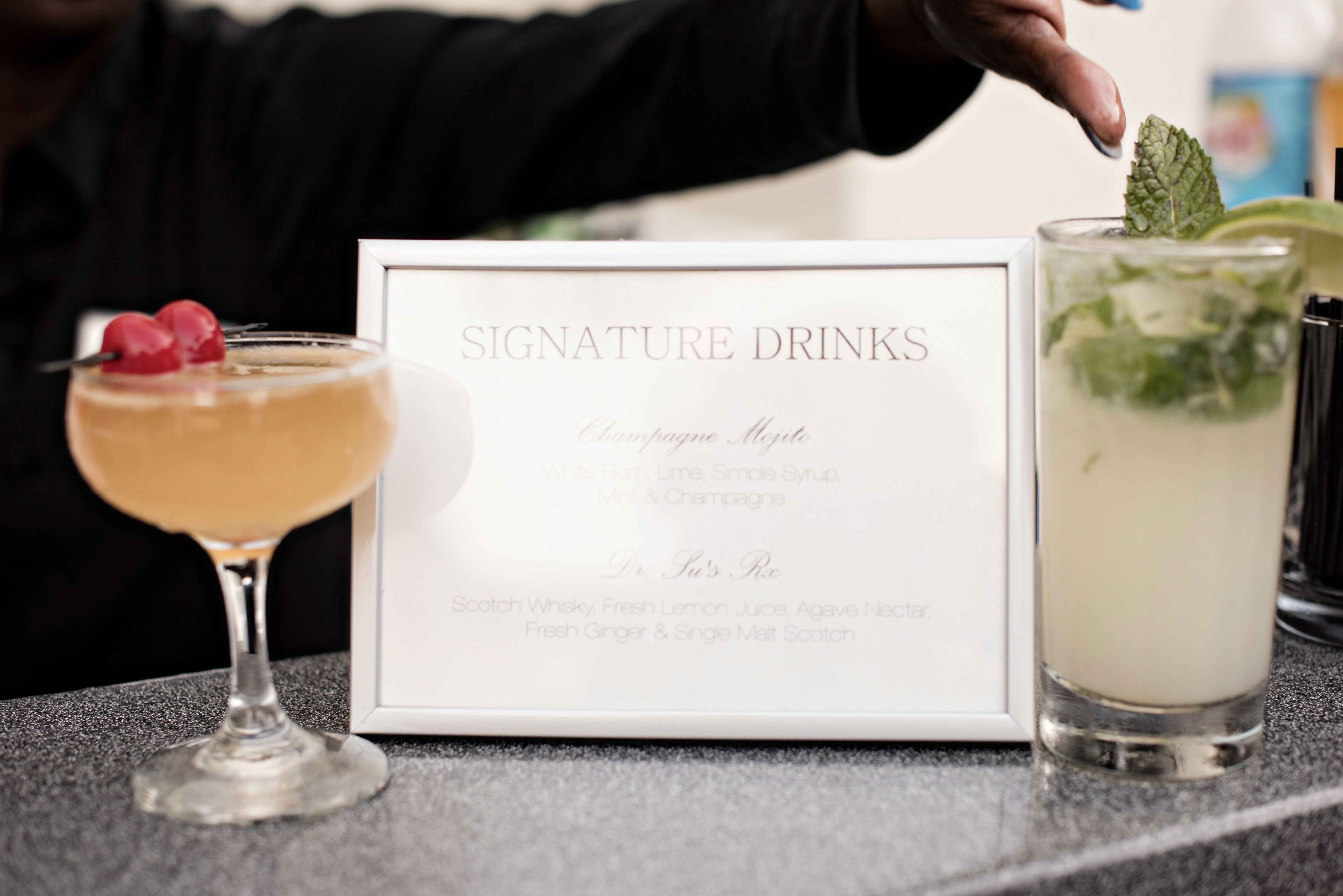 Signature Drink Signage Flanked by Cocktails