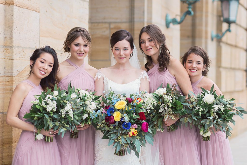 Bride in White, Bridesmaids in Light Pastel Pink