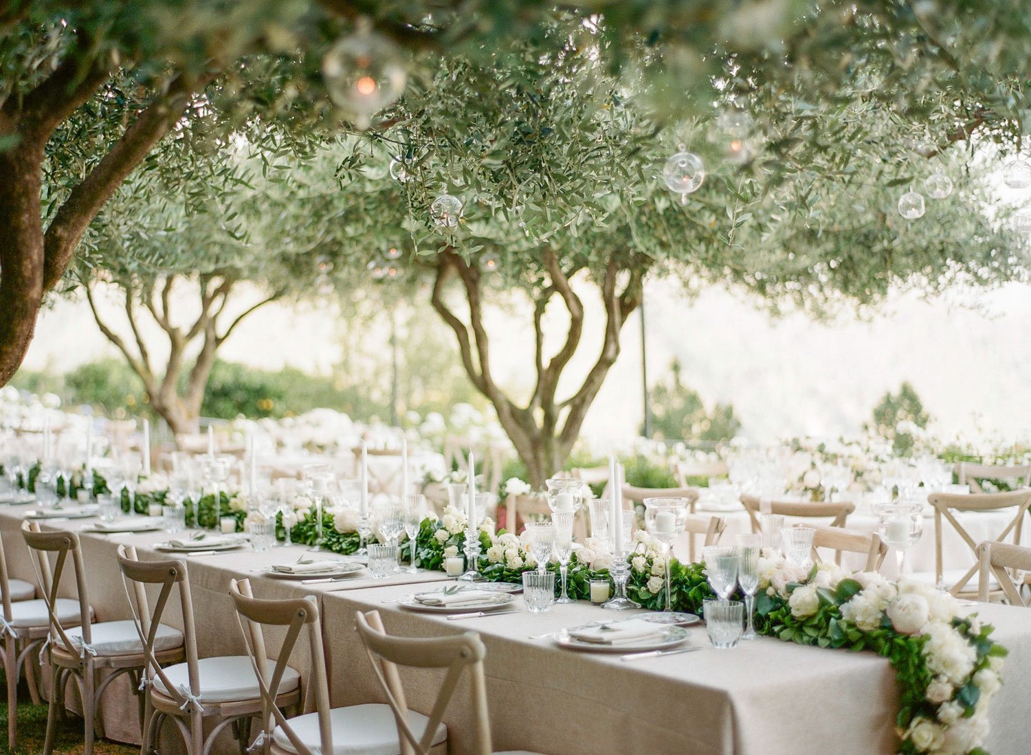 Long Table with Lush Garland Under Trees