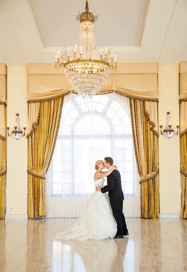 Couple Kiss in Luxurious Hallway