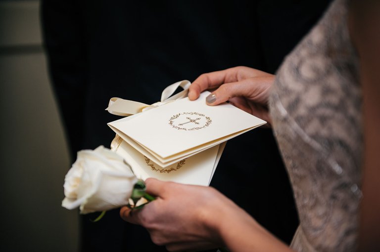 Attendant Handing Out Programs