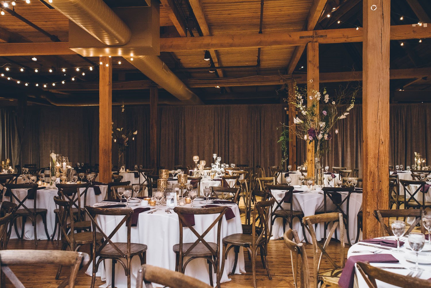 Rustic Wedding Reception with Wood Beams