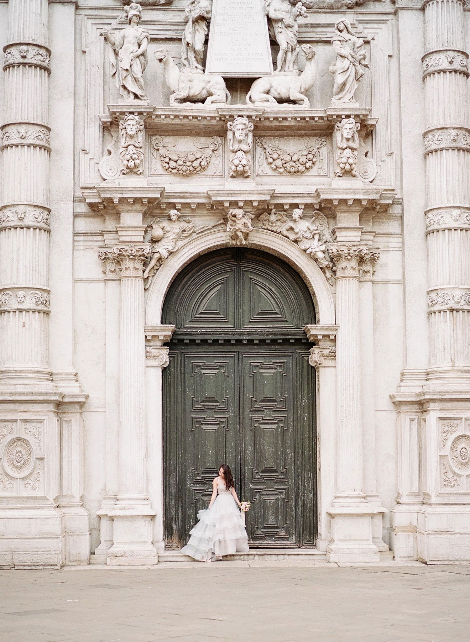 Bride in Front of Towering Door in Venice