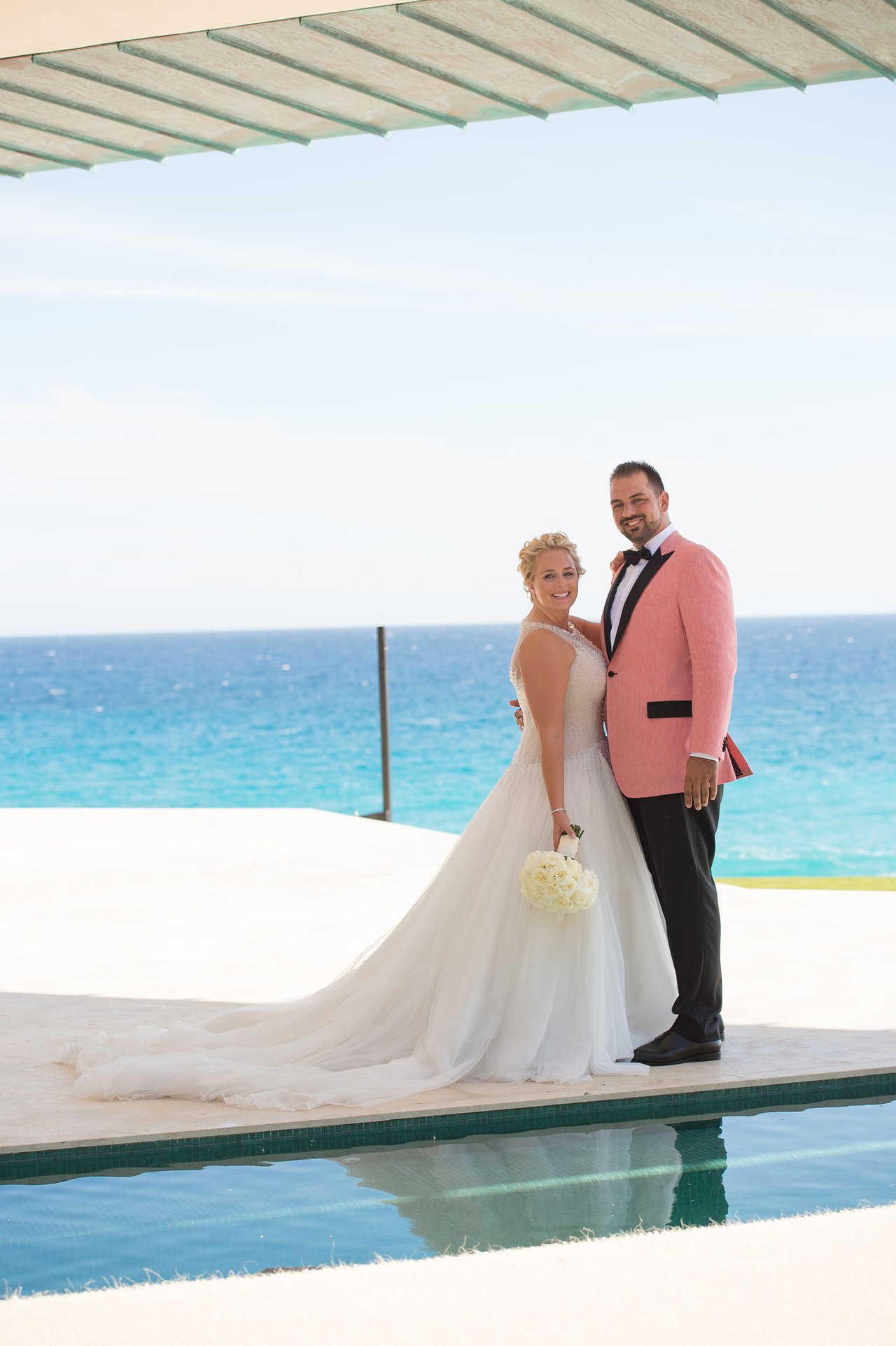 Bride and Groom by Ocean and Pool